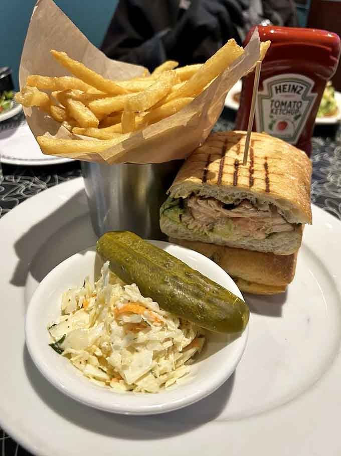 The sandwich that launched a thousand napkins. This panini, coleslaw, and fries combo is what lunch dreams are made of.