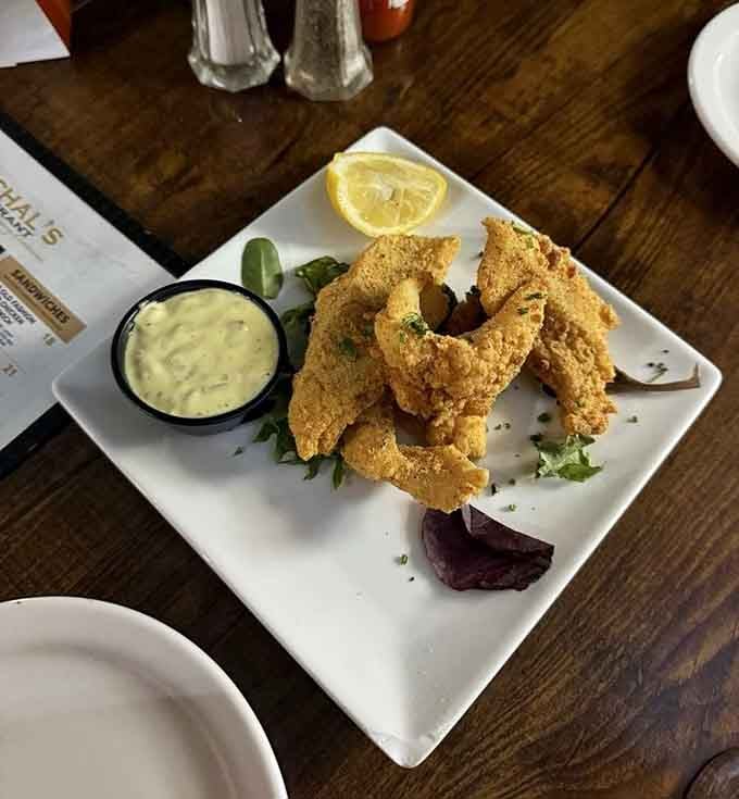 Crispy catfish fingers arrive ready to convert anyone who claims they don't like seafood into believers.