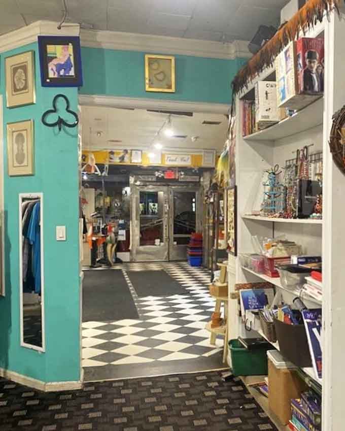 That checkerboard floor leads you deeper into the store, where turquoise walls and vintage treasures create an Instagram-worthy shopping experience.