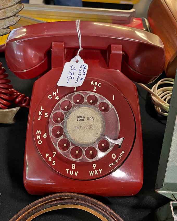 A cherry-red rotary phone that remembers when calling someone actually required patience and finger strength.