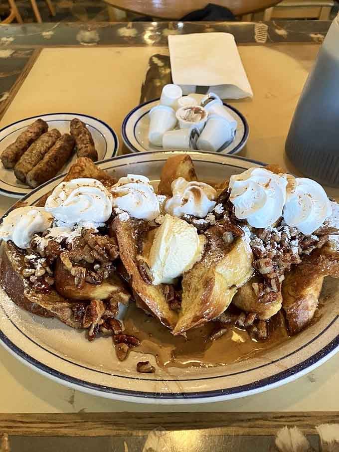 Pecan-topped French toast with enough toppings to qualify as dessert, yet somehow it's still socially acceptable before noon.