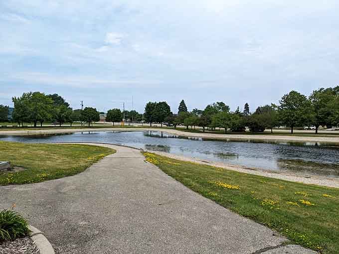 Pritchard Park's serene pond offers the perfect spot for contemplating life's big questions, like "Why don't I spend more time in parks?"