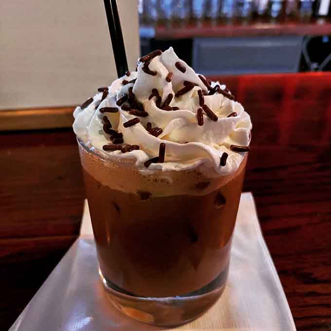 That whipped cream mountain topped with chocolate sprinkles makes adulting look absolutely delicious and completely justified.