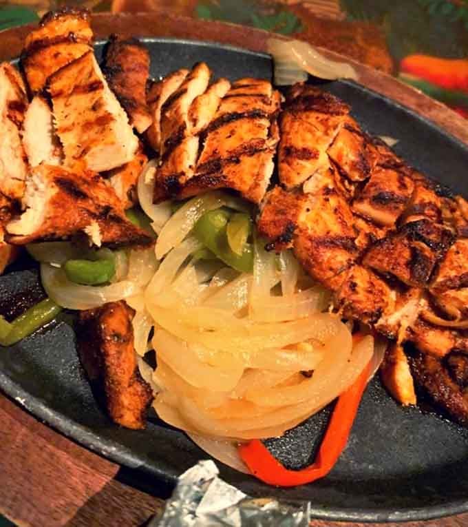 Sizzling fajitas arrive with the kind of dramatic flair that makes every meal feel like opening night on Broadway.