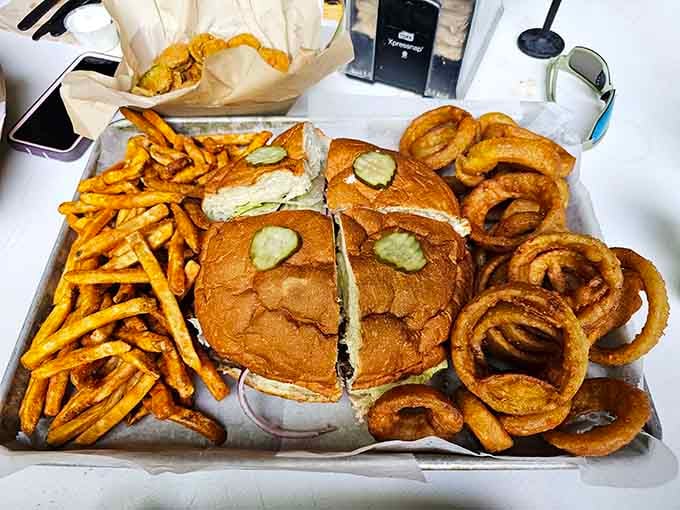 This burger comes with fries and onion rings because choosing between them would be cruel and unusual punishment.