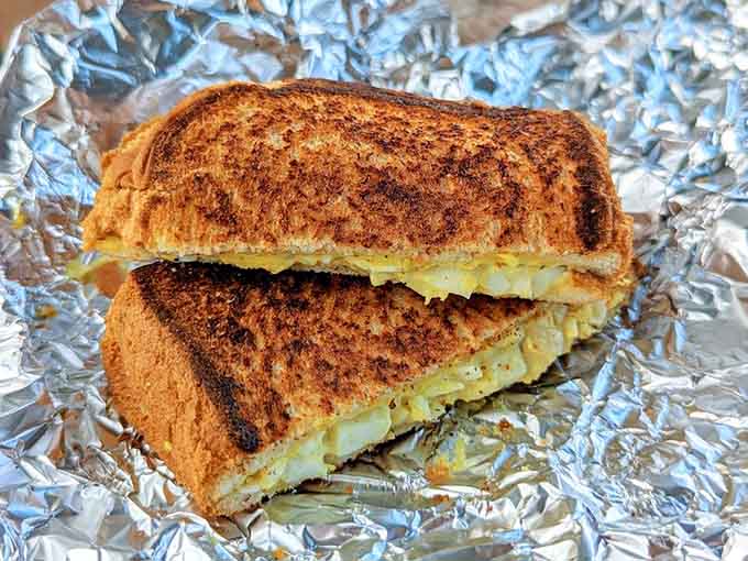 Grilled cheese done right, with that perfect golden crust that shatters at first bite revealing melted cheese perfection inside.