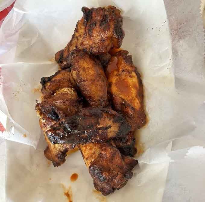 These wings have seen more smoke than a 1970s poker game, and they're all the better for it.