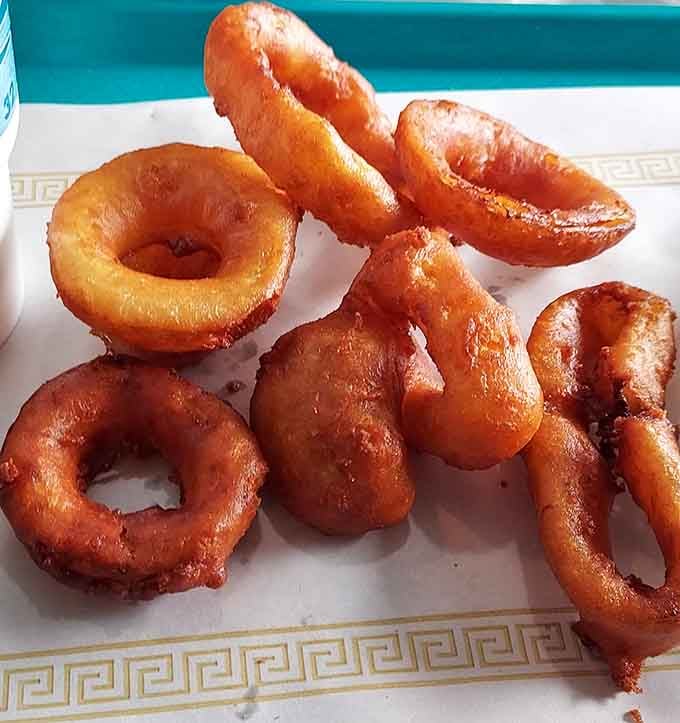 Golden onion rings so perfectly fried they deserve their own spot in the American comfort food hall of fame.