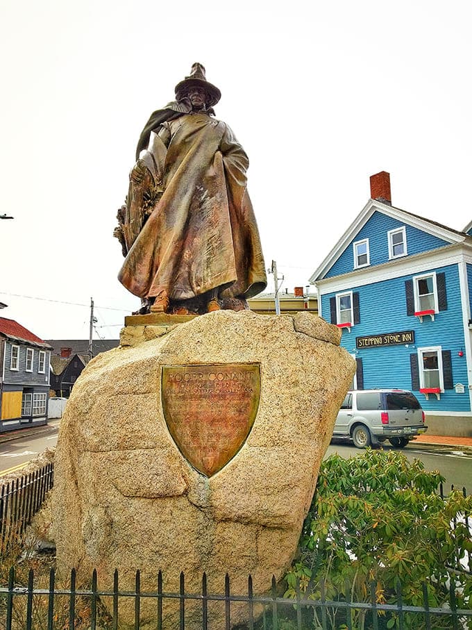 Roger Conant's statue honors Salem's founder, standing tall while tourists in witch hats walk past without irony.
