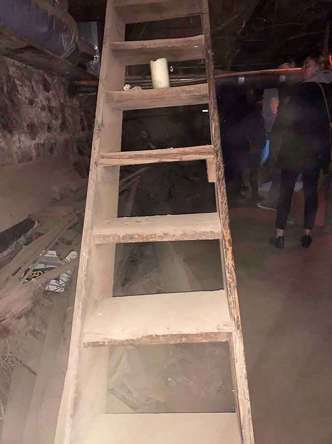 Steep wooden stairs leading down into history's basement, where the only way out was usually on a departing ship.