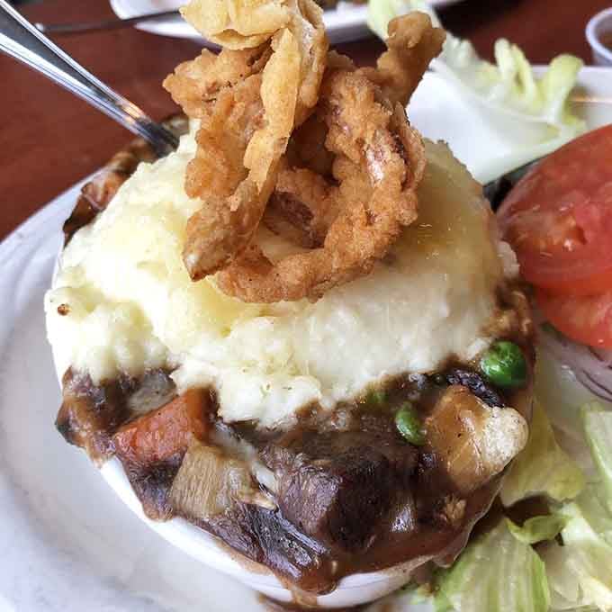 Shepherd's Pie topped with crispy onions is comfort food with colonial credentials &ndash; hearty, satisfying, and worthy of George Washington's approval.