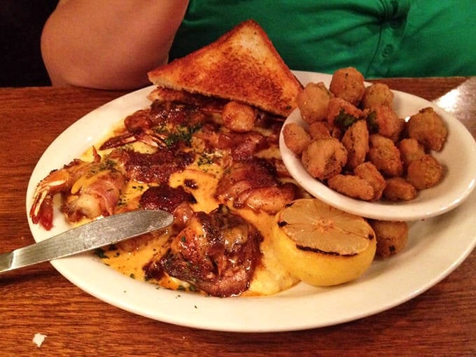 Southern comfort on a plate. Tender shrimp nestled against creamy, cheesy grits with a side of crispy potatoes&mdash;the kind of dish that makes you want to hug the chef.