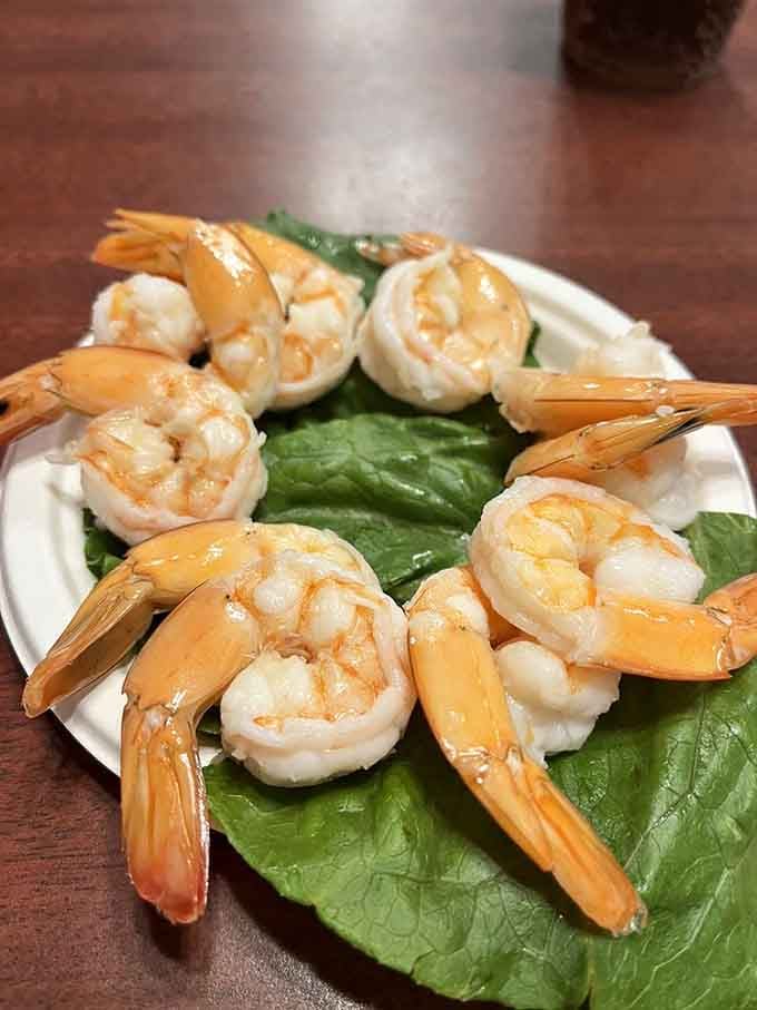Jumbo shrimp arranged like a delicious crown&mdash;royalty of the appetizer world, ready for their butter bath.