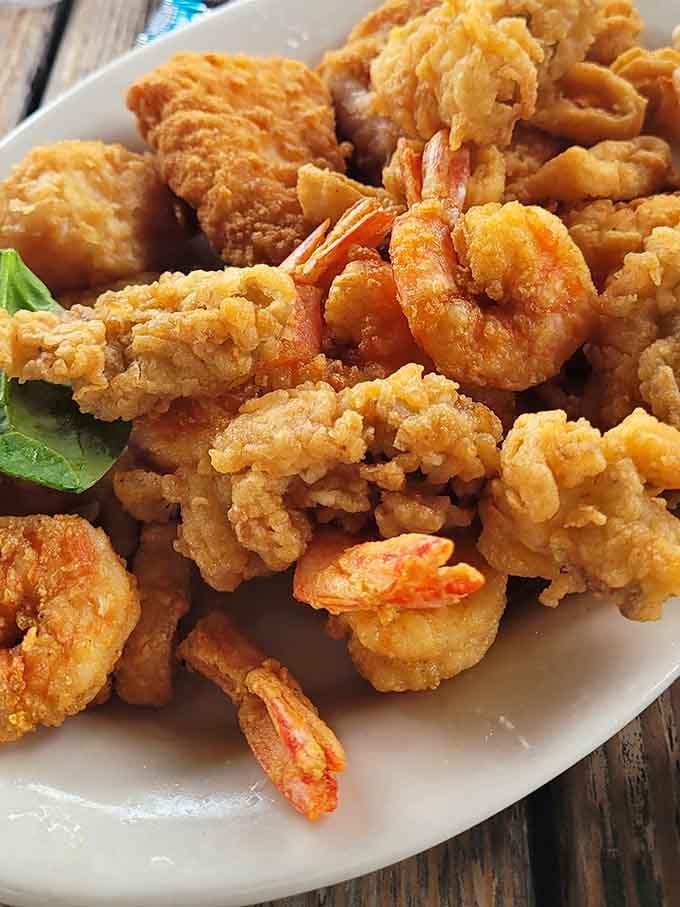Golden fried perfection featuring shrimp, calamari, and everything else the sea was willing to share that day.