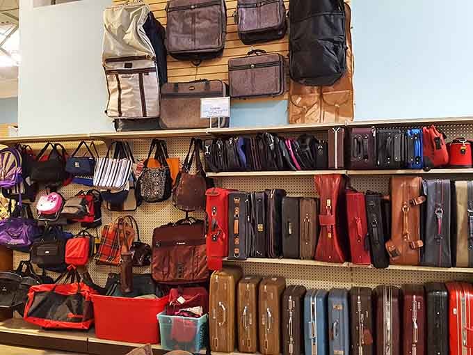 The bag wall offers everything from practical totes to vintage suitcases ready for their next adventure.