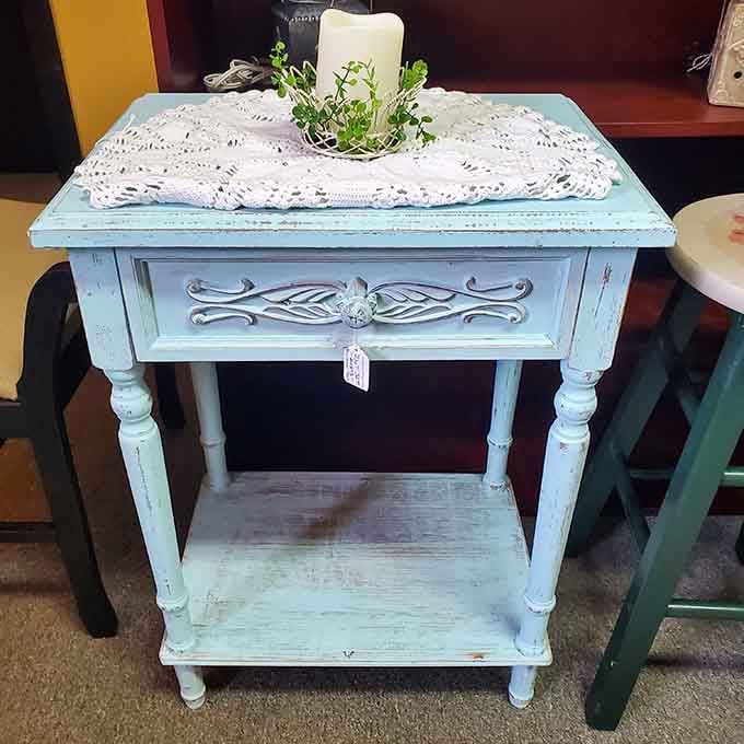 Shabby chic perfection in aqua blue, this side table is begging for a second act in someone's home.