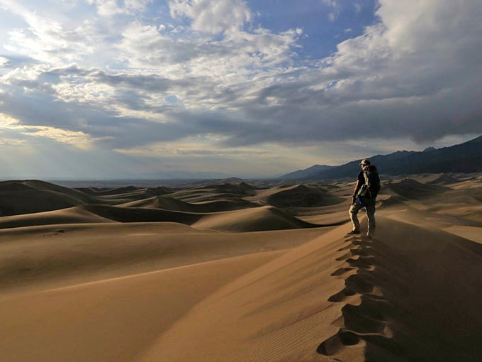 One brave soul conquers the ridge at sunset, earning bragging rights and sore calves for the week ahead.