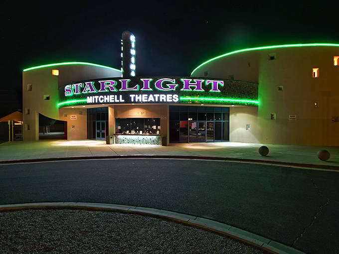 The Starlight Cinema glows like a neon oasis after dark, serving up Hollywood magic with that irreplaceable small-town theater charm.