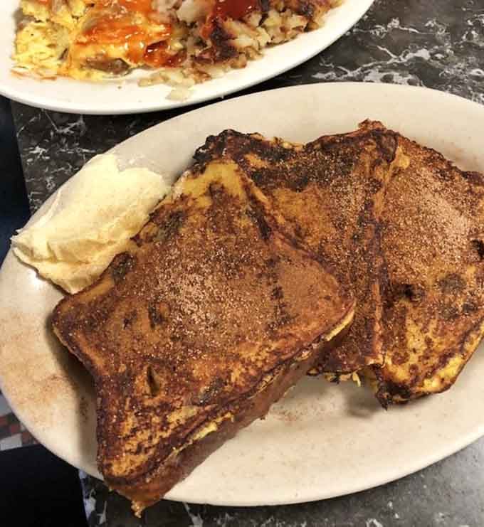 Cinnamon raisin French toast dusted with powdered sugar, because sometimes breakfast needs to feel like dessert.