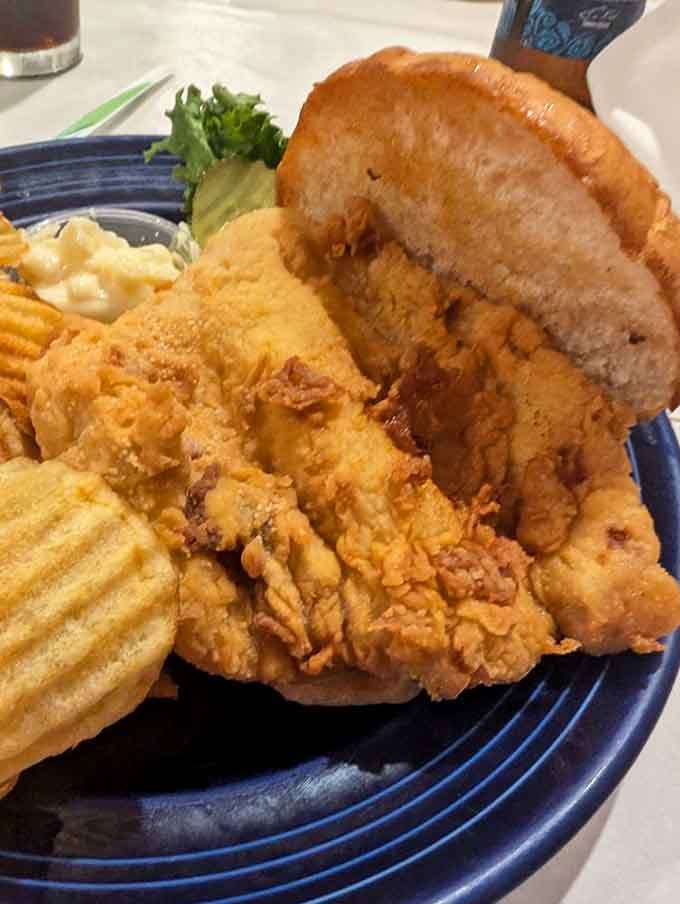 The breaded pork tenderloin arrives like a delicious UFO that's landed on your plate, crispy and impossibly satisfying.