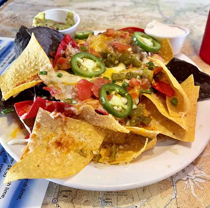 Nachos loaded with all the fixings, perfect for sharing or keeping entirely to yourself without any judgment here.