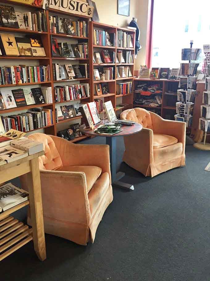 Cozy chairs nestled among the shelves invite you to test-drive your potential purchases before committing to the relationship.
