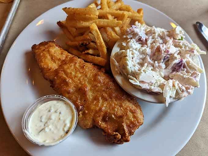 Fish and chips done right: crispy batter, flaky fish, and enough tartar sauce to make everything taste like vacation.
