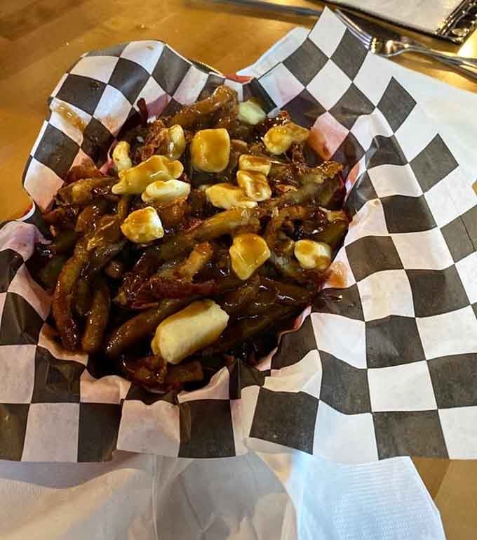 Poutine topped with cheese curds and gravy, proving Canadians and Wisconsinites share the same delicious wavelength.