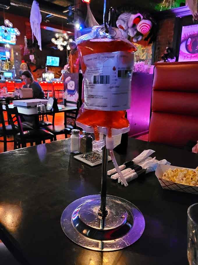 Your drink arrives in an IV bag because nothing says refreshment quite like medical equipment aesthetics.