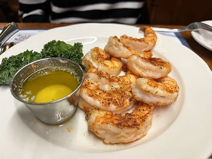 Shrimp arranged like they're posing for their senior portrait, golden and ready for their butter bath debut.