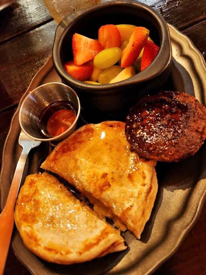 The Queen's breakfast at The Sparrow & Serpent includes sausage, toast, and fruit fit for royalty indeed.