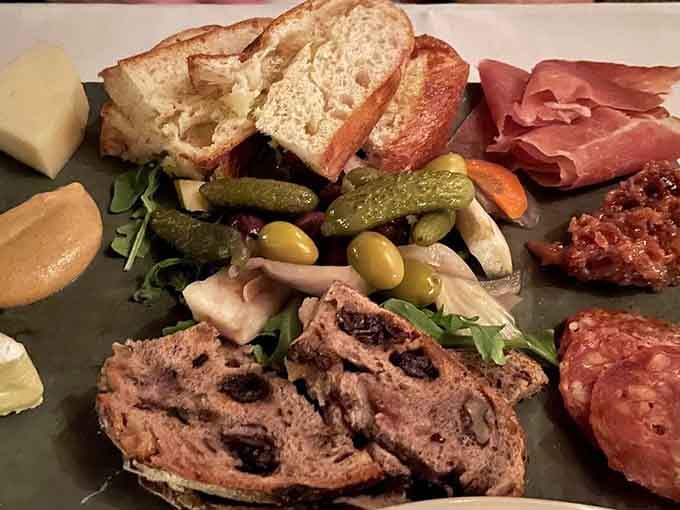 This charcuterie spread features cured meats, artisan cheeses, and crusty bread that'll make you forget you're underground.