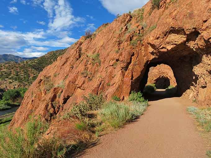 Nature carved this perfect rock tunnel long before Instagram existed, creating what might be Colorado's most frame-worthy hiking trail.