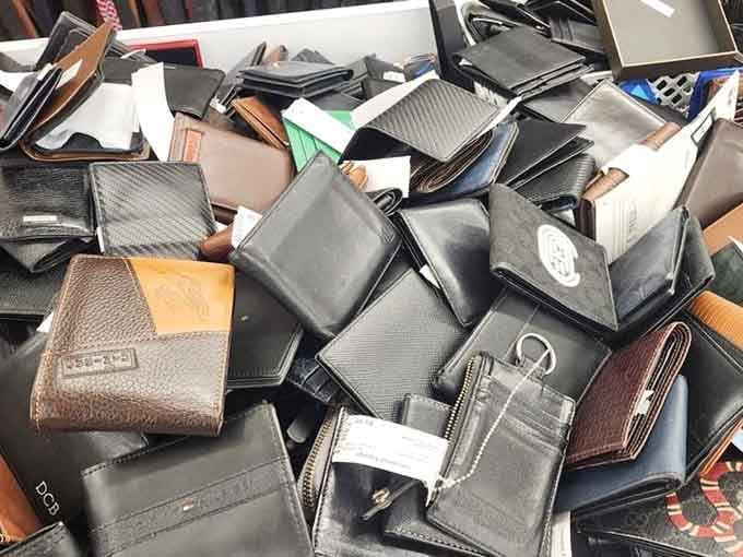 A pile of wallets representing hundreds of stories, now waiting to hold your cards and cash instead.