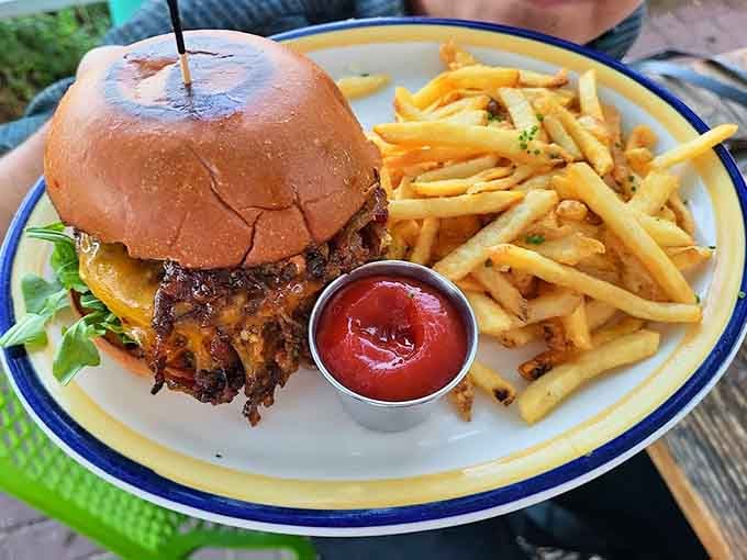 This burger comes with fries and ketchup, the holy trinity of diner satisfaction that never gets old.