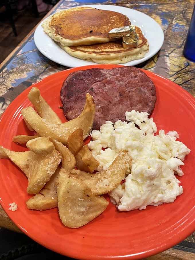 The Mountain High breakfast doesn't mess around, delivering pancakes, ham, eggs, and potatoes like breakfast's greatest collaboration album ever recorded.