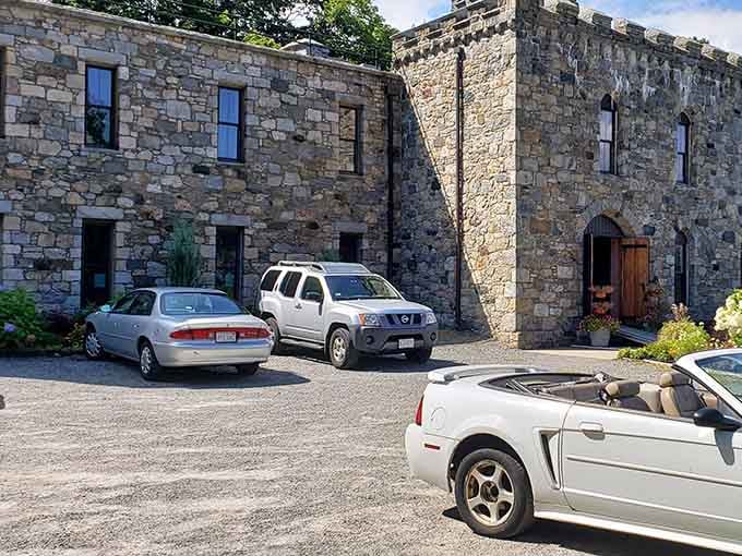 Modern cars meet medieval architecture in the most delightfully anachronistic parking situation you'll ever experience.