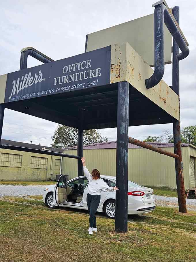 The classic "look how tiny I am" photo opportunity that every roadside attraction visitor absolutely must capture.