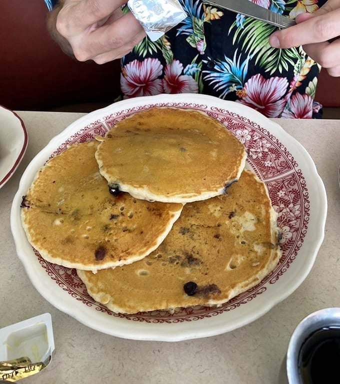 Blueberry pancakes so fluffy they practically float off the plate—breakfast doesn't get more picture-perfect than this.