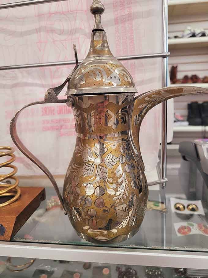 This ornate Middle Eastern coffee pot isn't just decorative&mdash;it's a conversation piece with history etched into its golden surface.