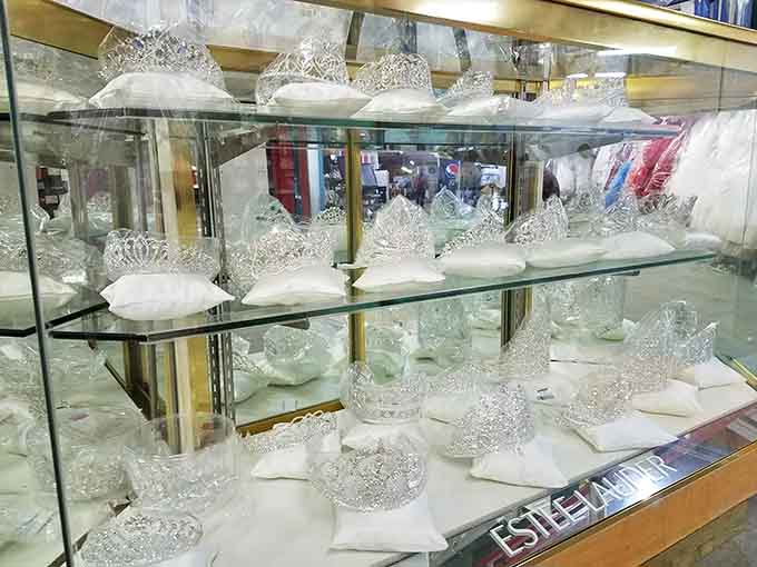 Sparkling tiaras and crystal treasures catch the light like a dragon's hoard, making everyone feel like royalty on a peasant's budget.