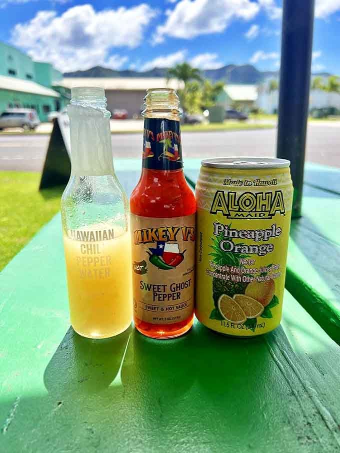 The perfect Hawaiian beverage lineup: Hawaiian Chili Pepper Water for heat seekers, Sweet Ghost Pepper sauce for the brave, and Aloha Maid for cooling relief.