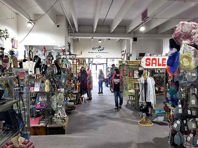 Where shoppers become time travelers. The wide aisles invite exploration while the "SALE" sign promises affordable nostalgia.