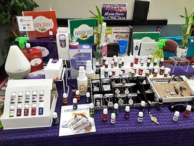 Essential oils and aromatherapy treasures arranged with care. Someone's path to zen and good smells is just a purple tablecloth away.