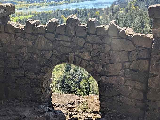 This stone archway frames the view like Mother Nature's own Instagram filter, no hashtags required.