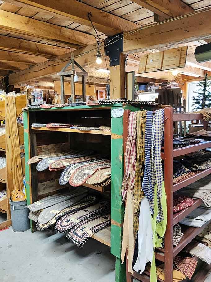 Handcrafted rugs and textiles stacked like colorful chapters of Americana, ready to warm both floors and hearts in their next homes.