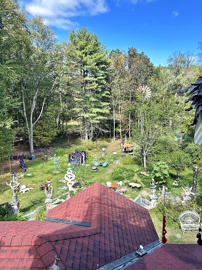 From above, the property reveals itself as a sculpture garden where art pieces emerge from the landscape like colorful mushrooms after rain.