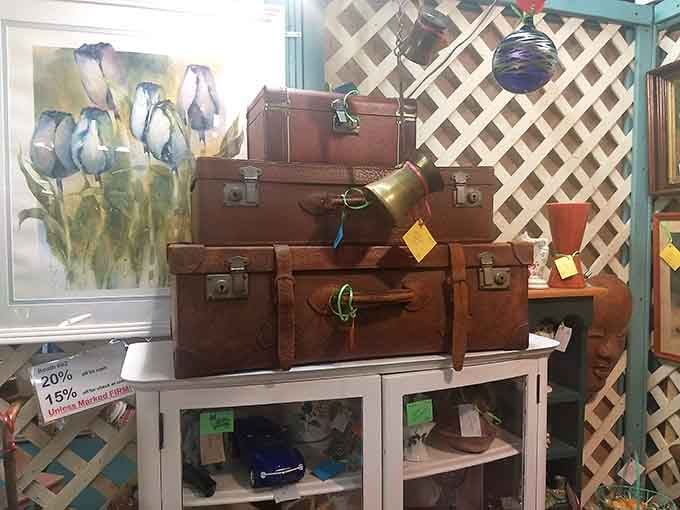Stacked vintage luggage tells stories of journeys past, when travel meant style and suitcases were built like tanks.