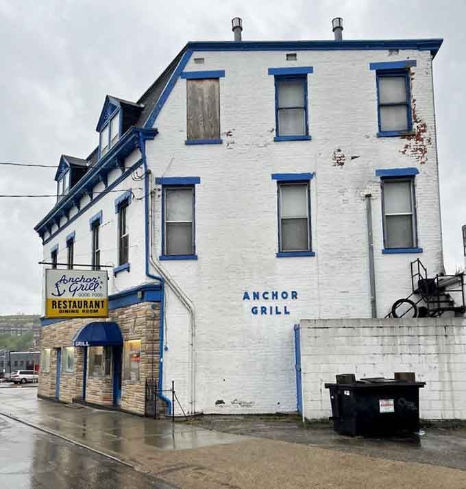 This white building with blue trim has been feeding generations, standing strong like your reliable old Buick.