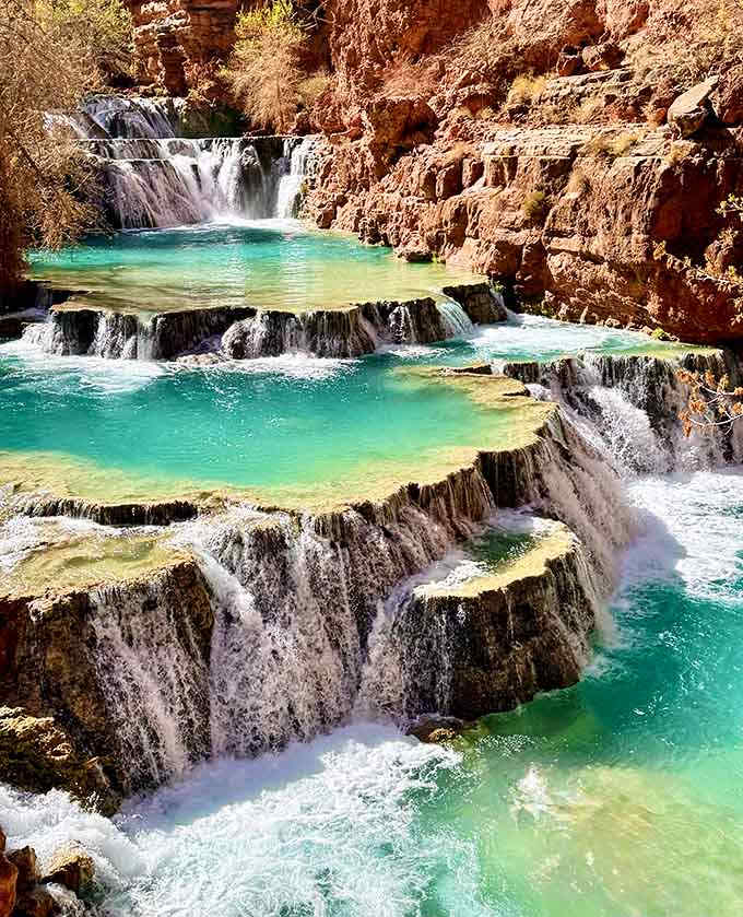 These terraced pools cascade like a natural water park designed by geological engineers with impeccable taste.